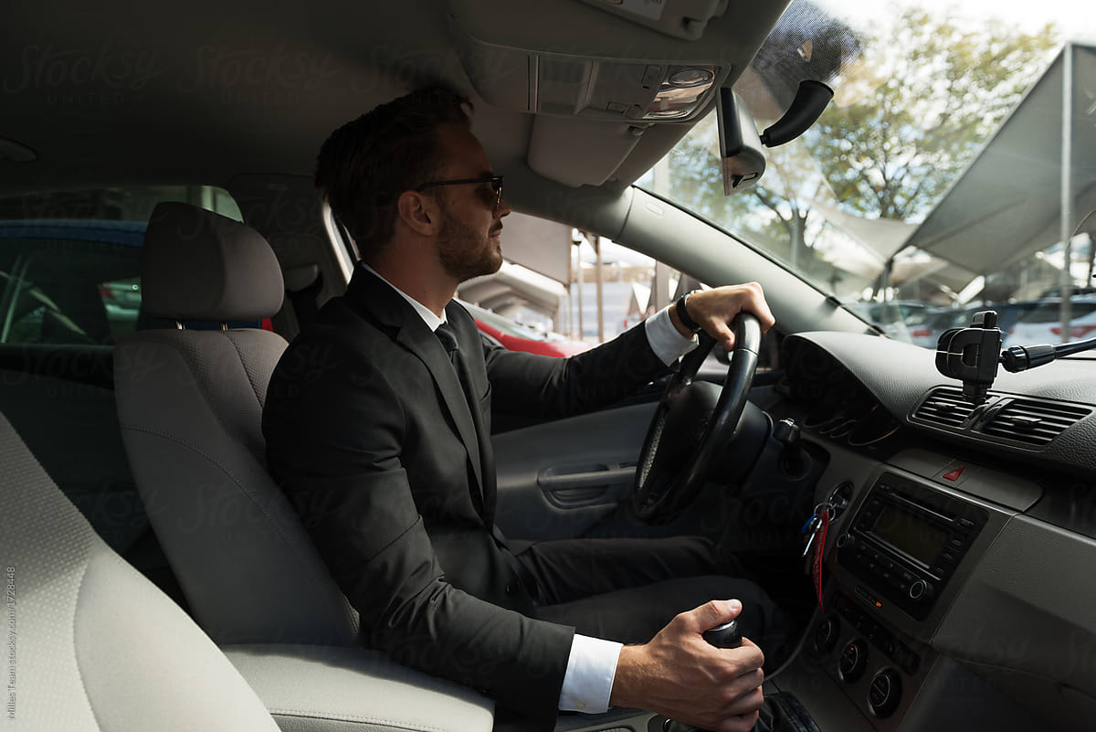 "Elegant Man Driving Car" by Stocksy Contributor "Milles Team" - Stocksy