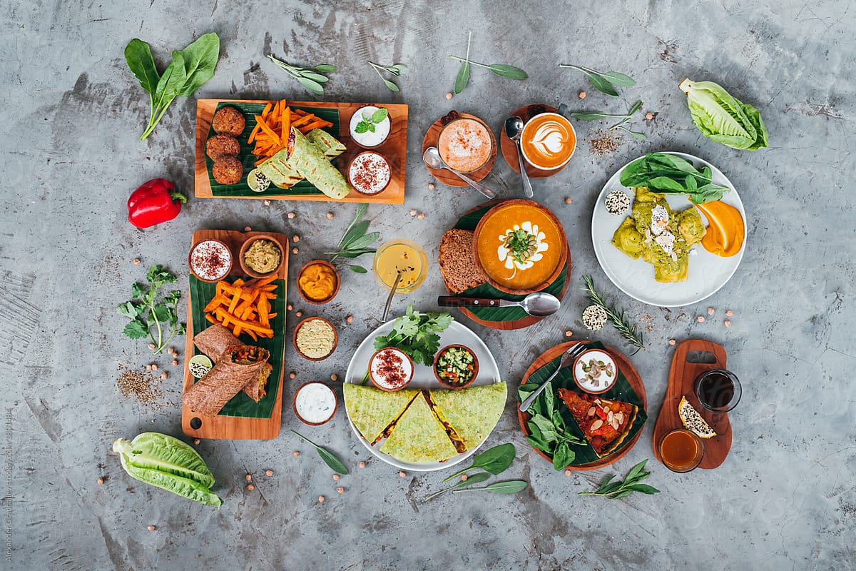 "Vegetarian Food On A Table At Cafe" by Stocksy Contributor "Eugenia ...