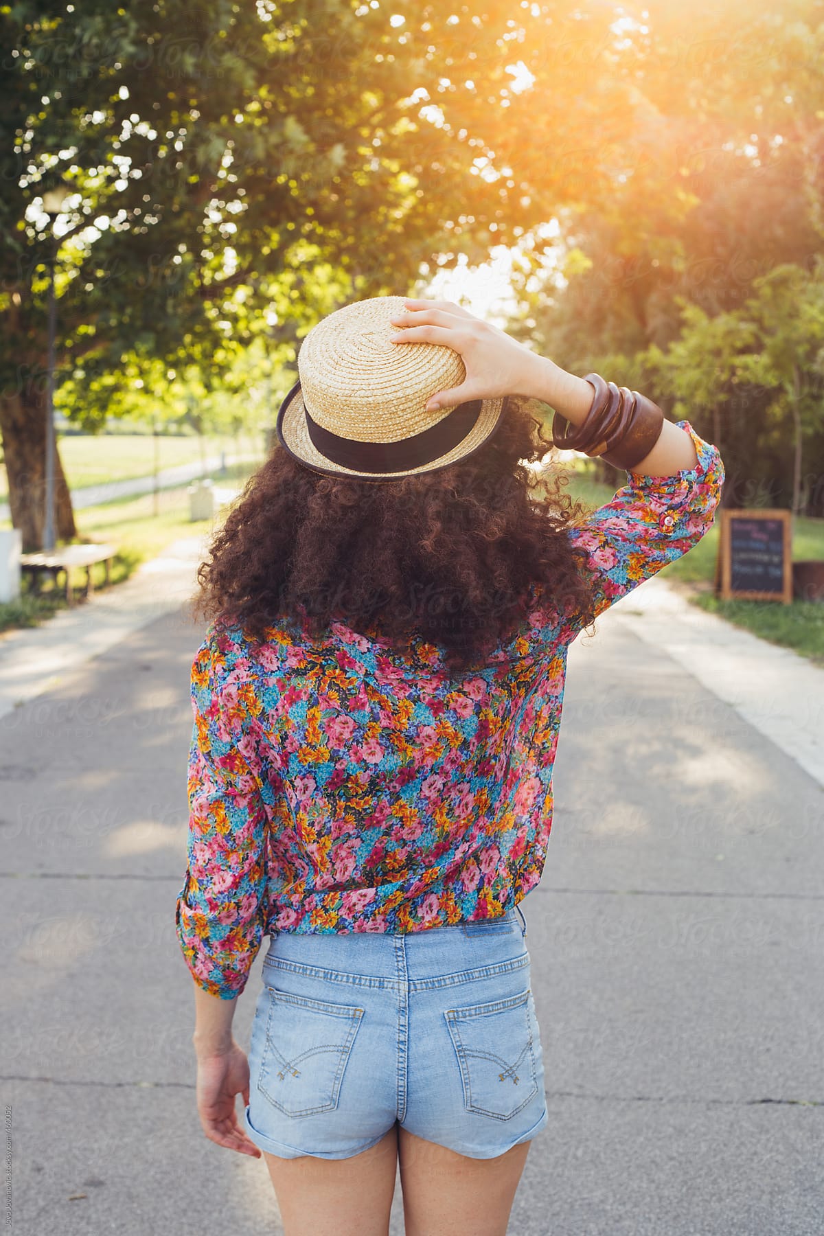 "Girl Holding Her Hat Outside At Street" by Stocksy Contributor "Jovo ...