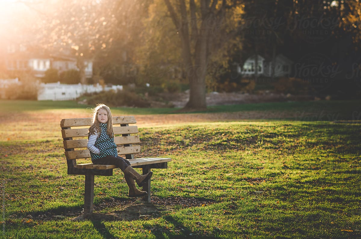 "Girl Sitting On A Bench" by Stocksy Contributor "Lindsay Crandall ...