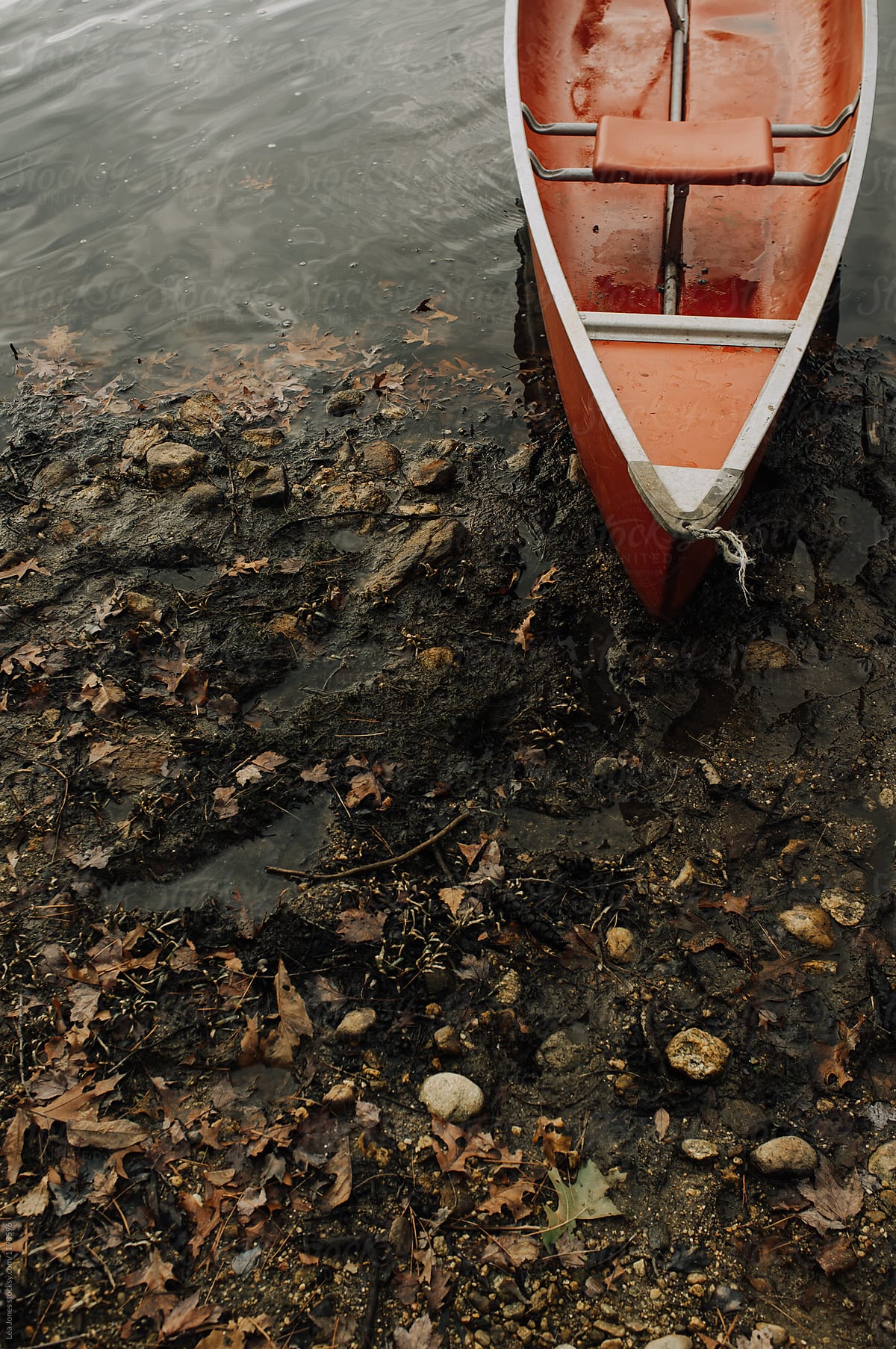 "Orange Canoe On Shore" by Stocksy Contributor "Lea Jones" - Stocksy