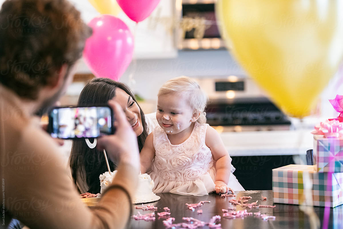 "First Birthday Cell Phone Photo" by Stocksy Contributor "Sean Locke ...