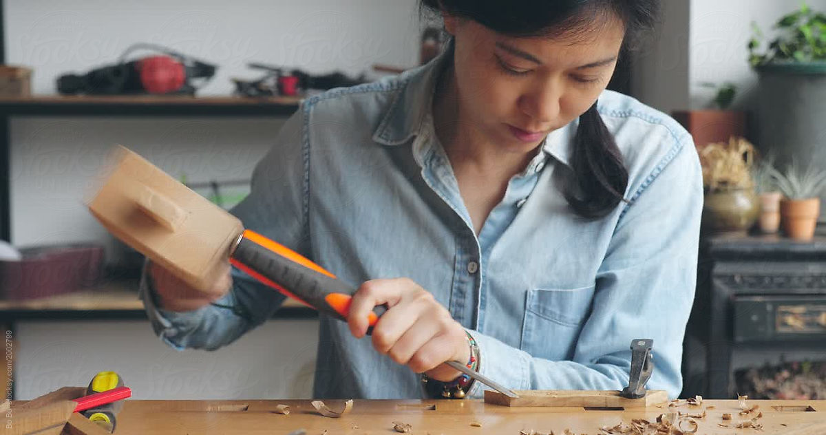 "Asian Female Carpenter Focus On Carving" by Stocksy Contributor "Bo Bo ...