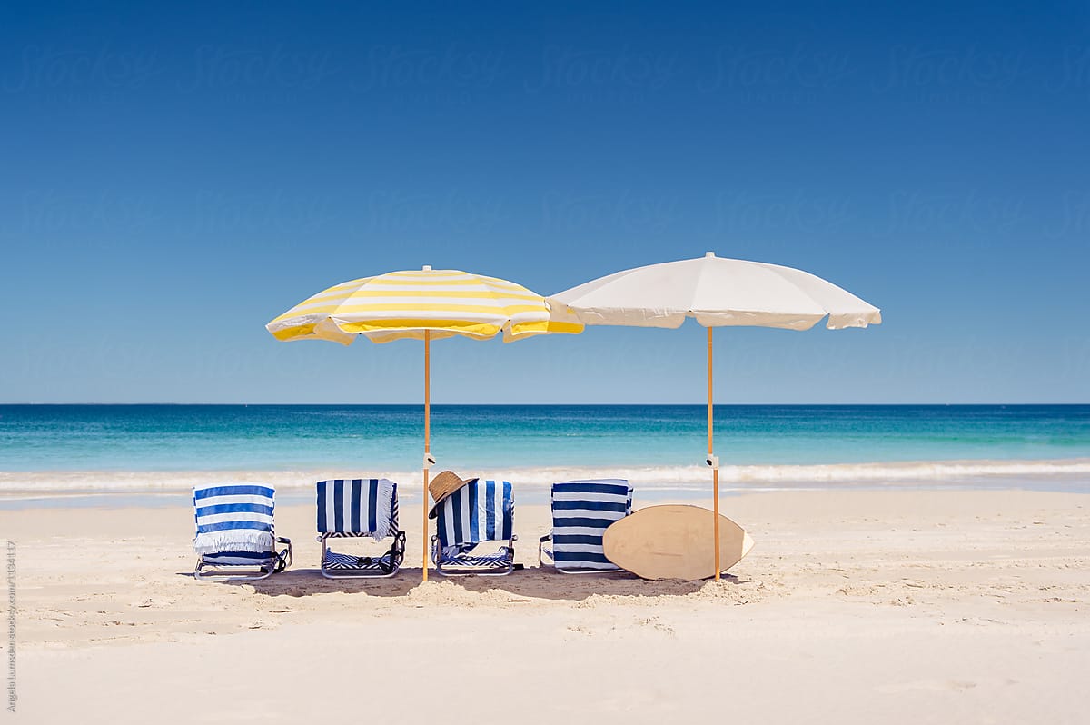 "Group Of Four Beach Chairs With Beach Umbrellas" by Stocksy ...