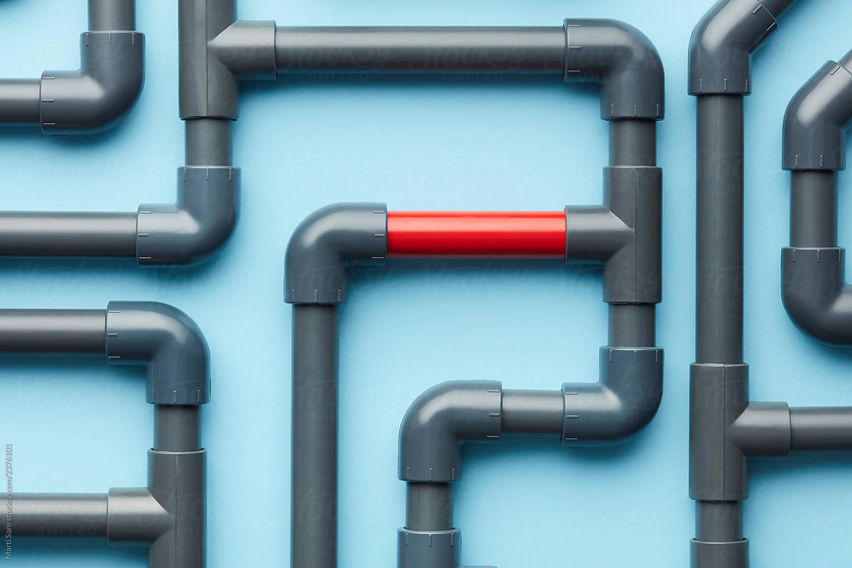 "Red Element In Connection Of Gray Pipes" by Stocksy Contributor "Martí ...