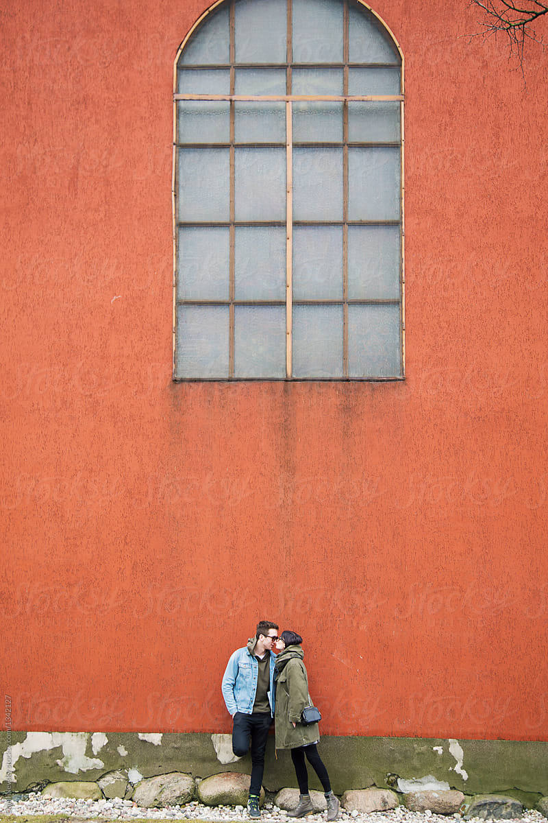 "A Couple Kissing At The Wall" by Stocksy Contributor "Danil Nevsky ...