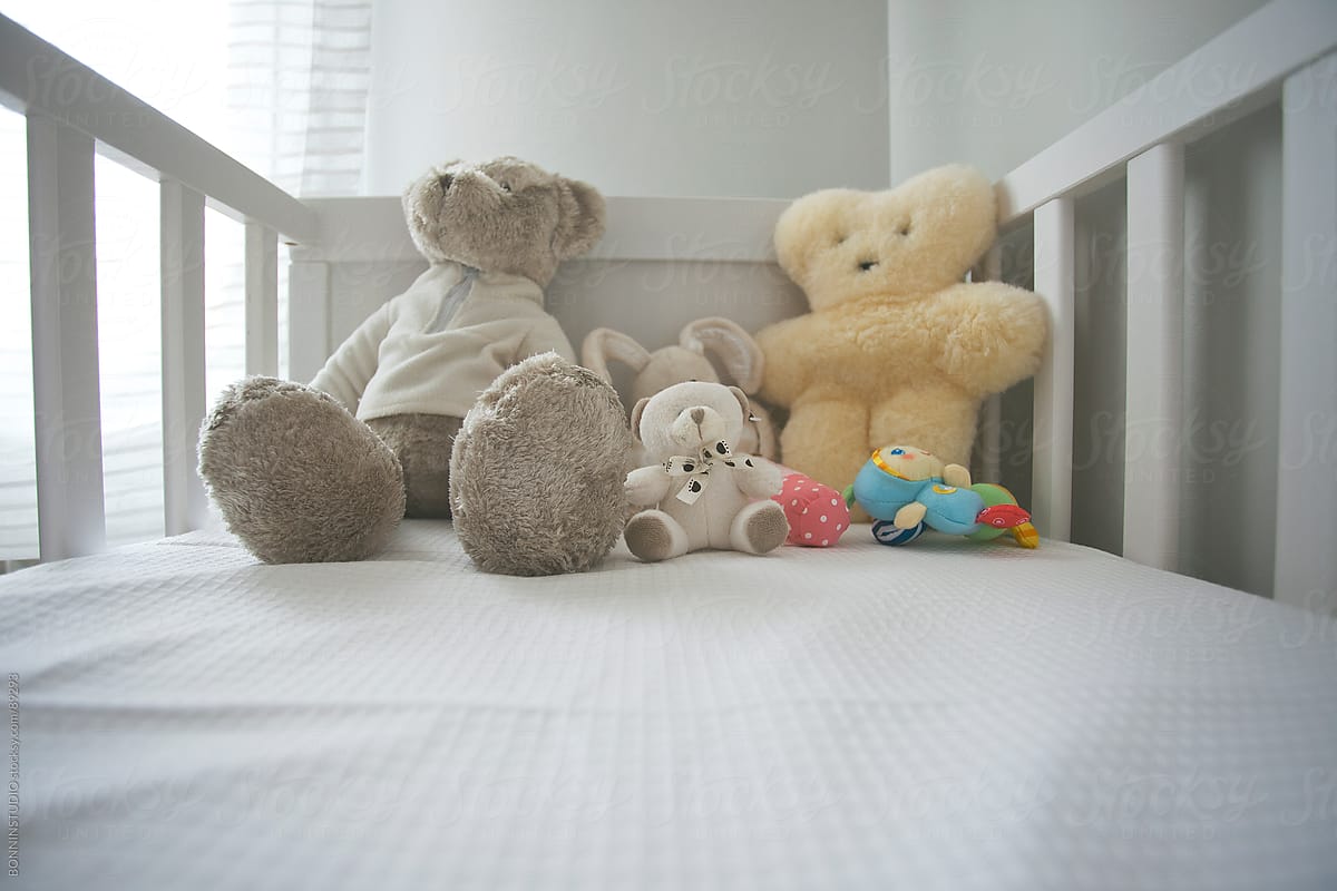 "A Cute Crib Of A Baby With Variety Of Teddies." by Stocksy Contributor ...