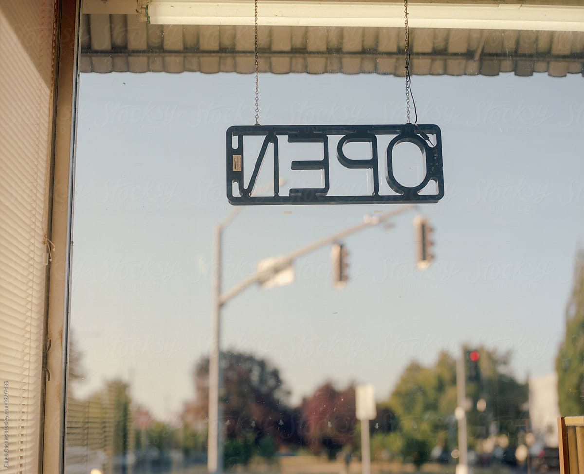 ""Open" Sign From Inside A Shop" by Stocksy Contributor "Caleb Gaskins ...