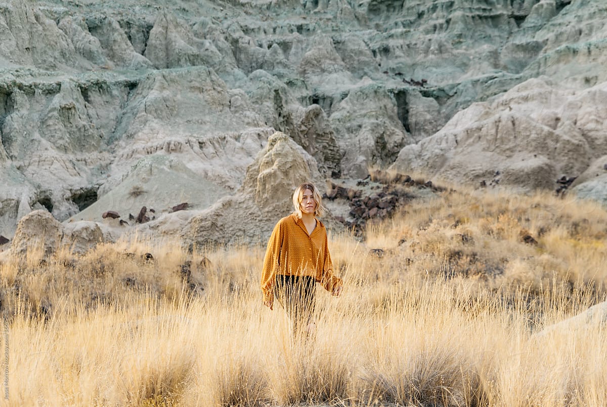 "Woman Walking Through Tall Grass" by Stocksy Contributor "Jesse Morrow ...