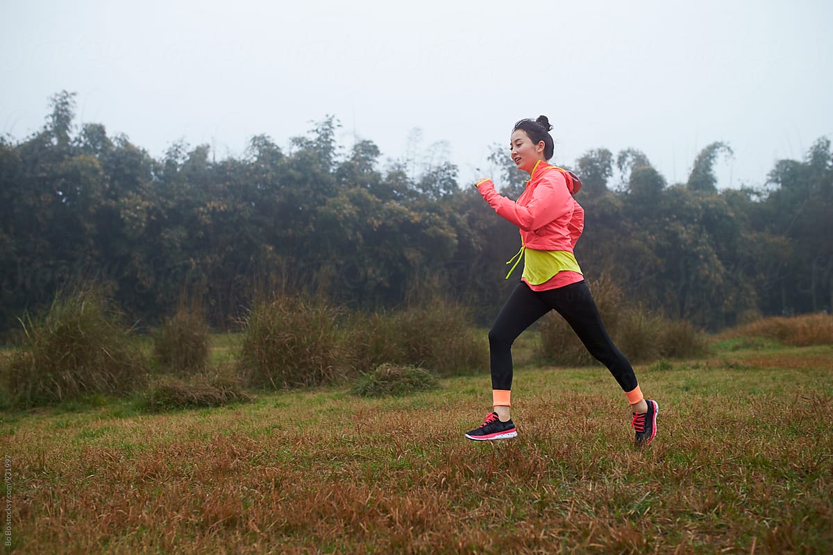 "Pretty Young Asian Woman Running Outdoor" by Stocksy Contributor "Bo ...