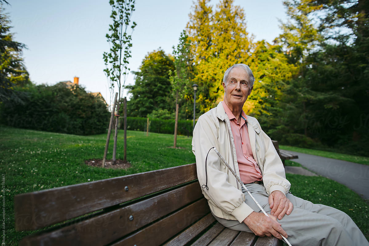 "Visually Impaired Older Man Sitting On Bench In Nature" by Stocksy ...