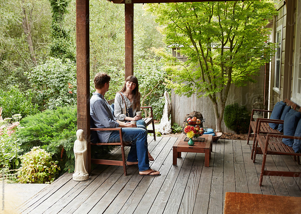 "Couple Relaxing On Front Porch Drinking Tea At Day Spa" by Stocksy ...
