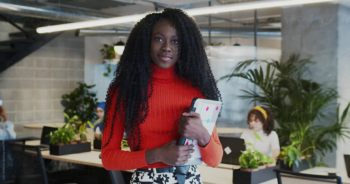 "Woman Co-worker In The Office." by Stocksy Contributor "Luis Velasco ...