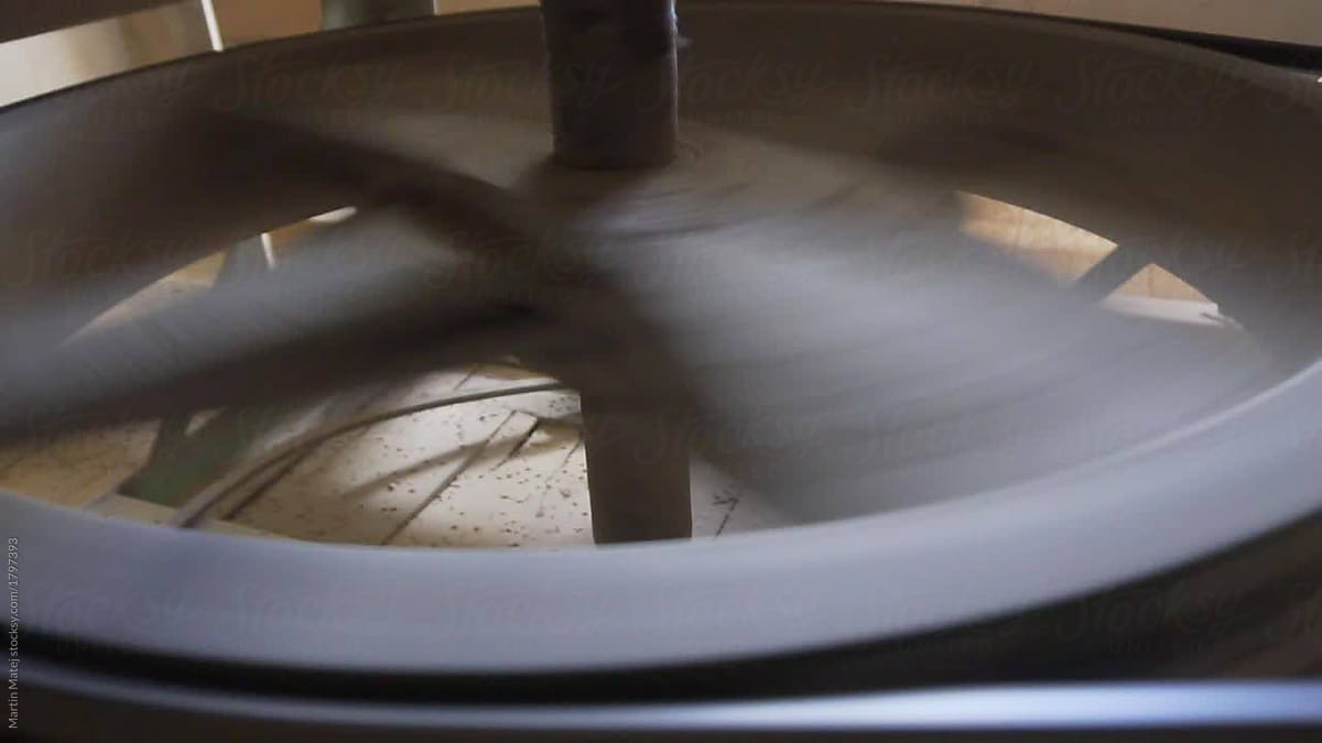 "Dolly Out From Big Wheel Turning In Traditional Mill" by Stocksy ...