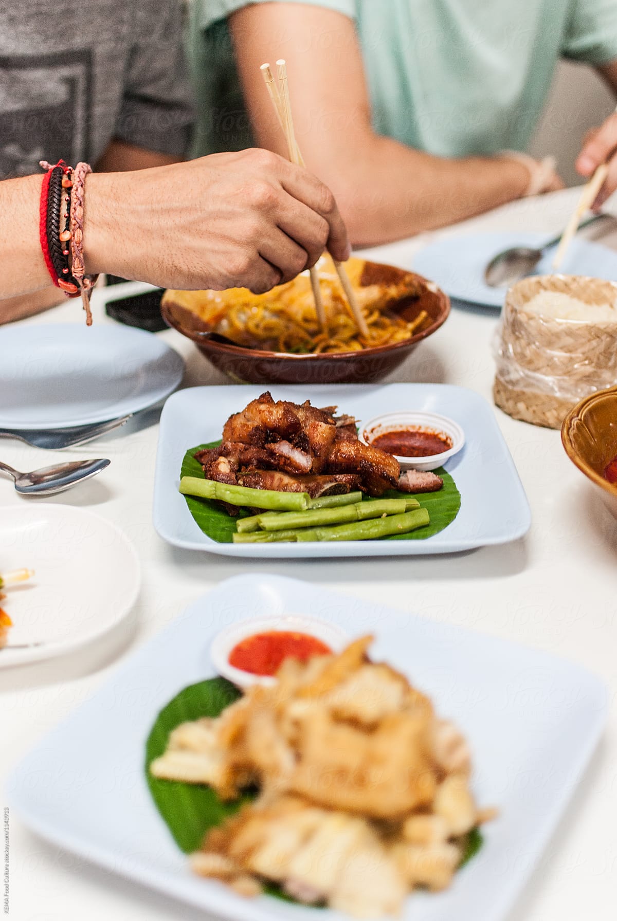 "Eating Thai Food" by Stocksy Contributor "Marta Mauri" - Stocksy