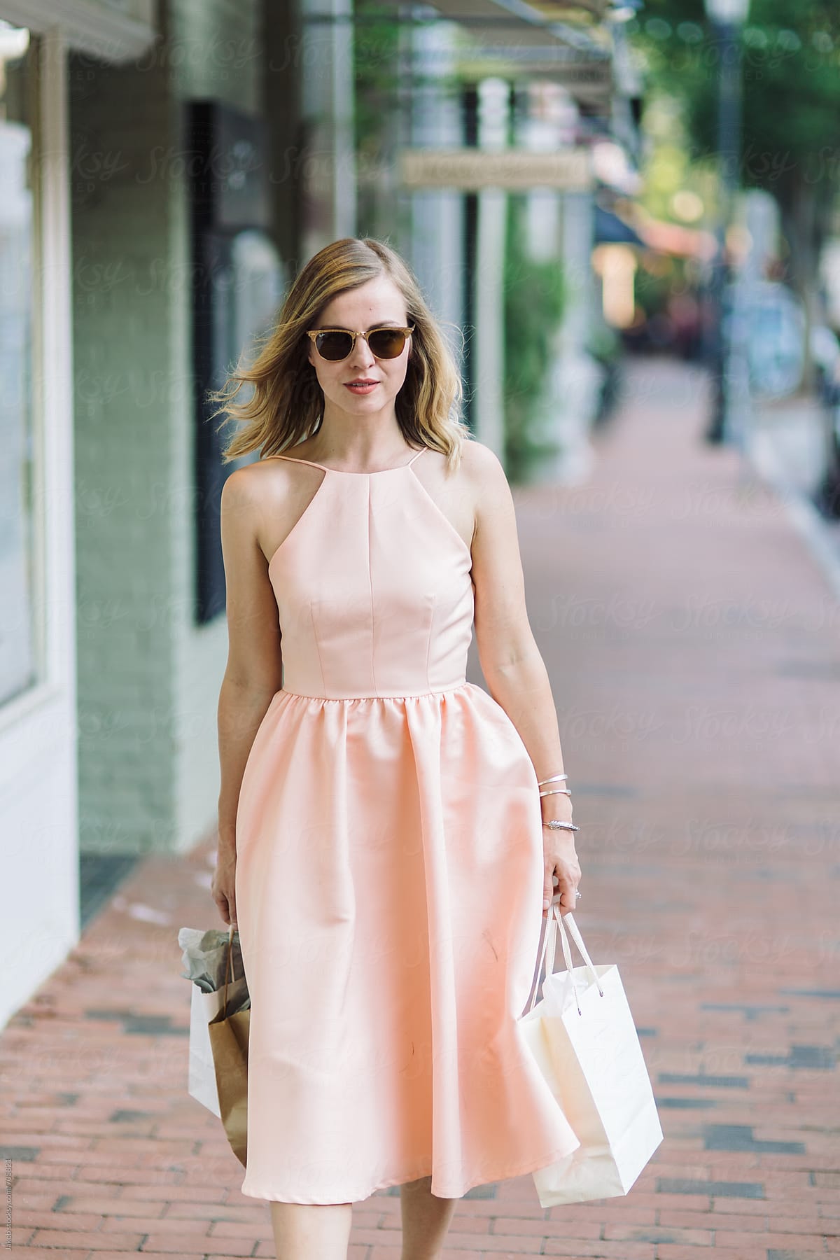 "Beautiful Woman Shopping Outside" by Stocksy Contributor "Jakob ...