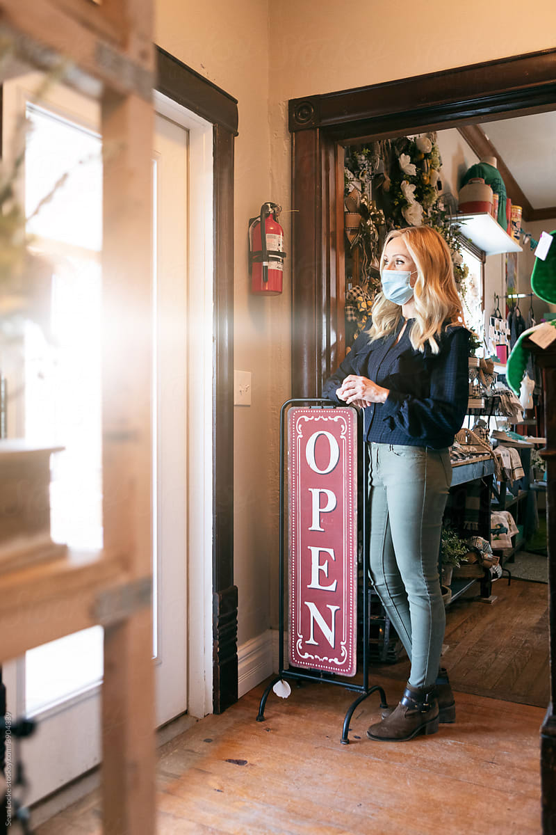 "Boutique: Shop Owner Waits By Open Sign For Customers" by Stocksy ...