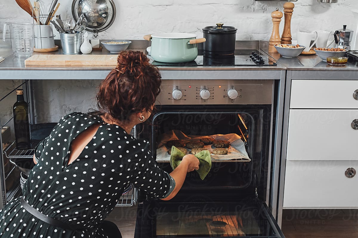 "Woman Baking In Her Kitchen" by Stocksy Contributor "Lumina" - Stocksy
