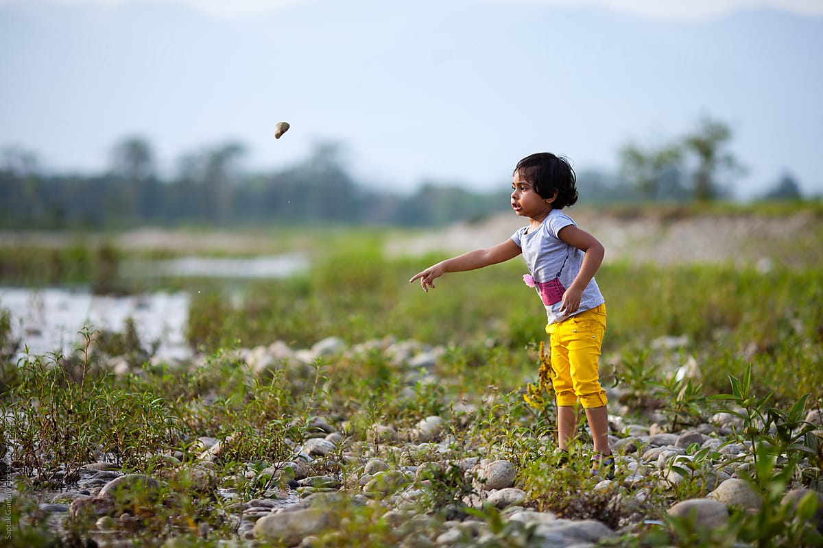 "Little Girl Throwing Stone At The River" by Stocksy Contributor ...