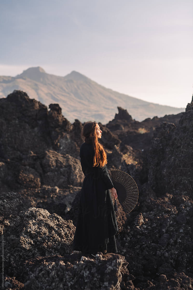"Mystical Woman Standing In Volcanic Landscape At Sunrise" by Stocksy ...