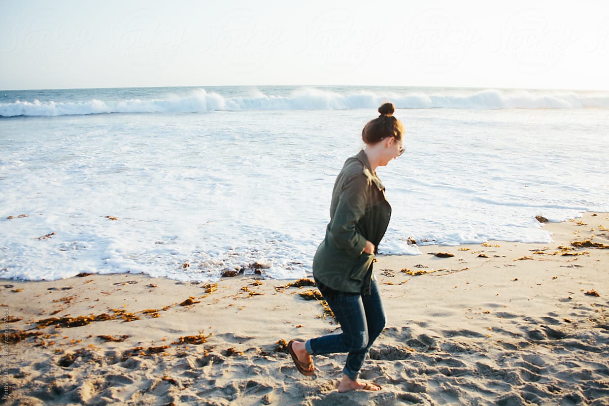 "Beach Walk At Sunset" by Stocksy Contributor "Matthew Linker" - Stocksy