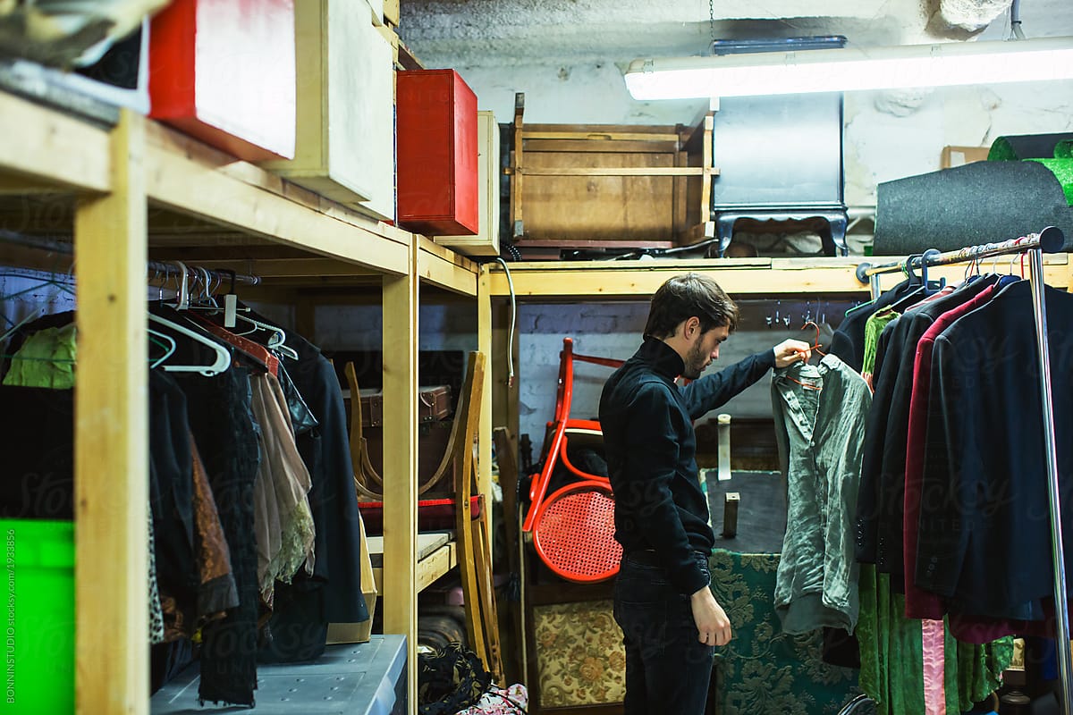 "Actor Choosing Clothes In Locker Room." by Stocksy Contributor ...