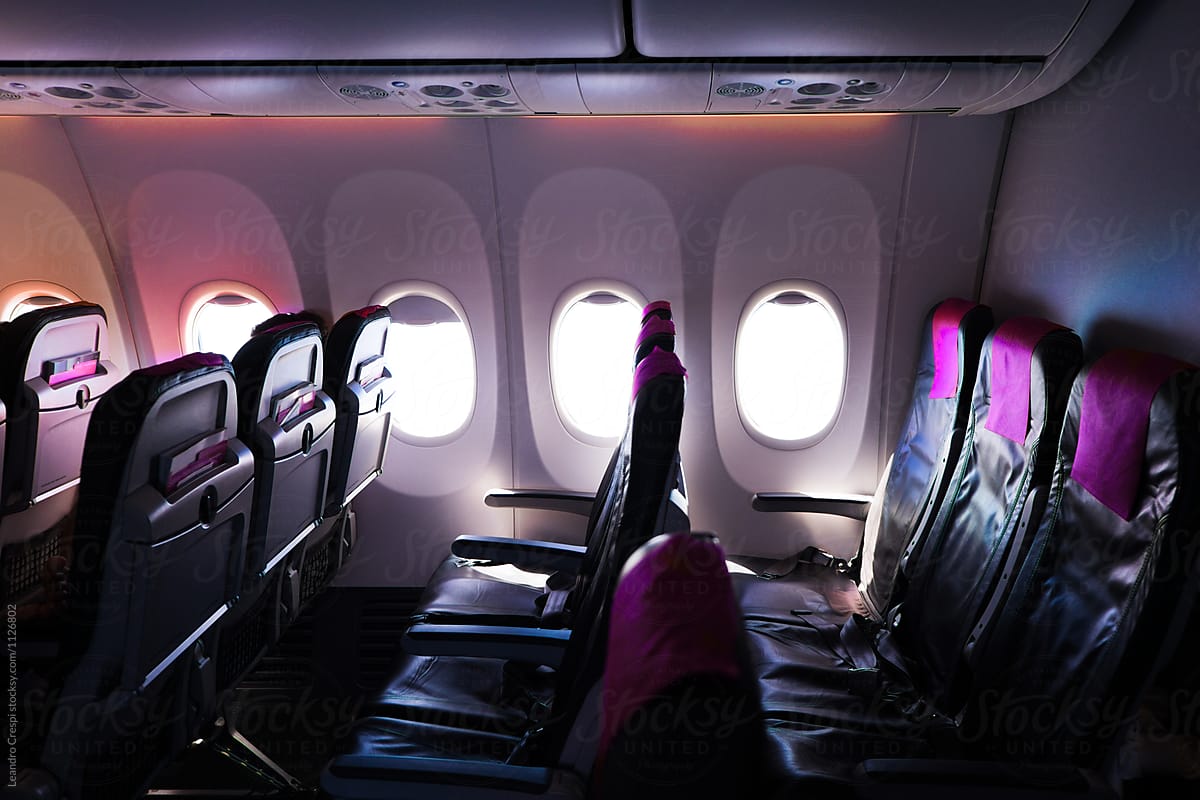 "Airplane Interior Seats" by Stocksy Contributor "Leandro Crespi" - Stocksy