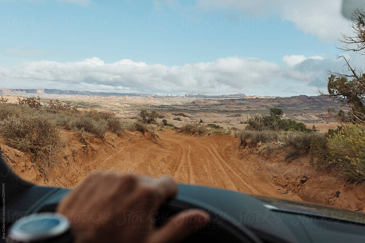 "Adventurer Man Driving" by Stocksy Contributor "Blue Collectors" - Stocksy