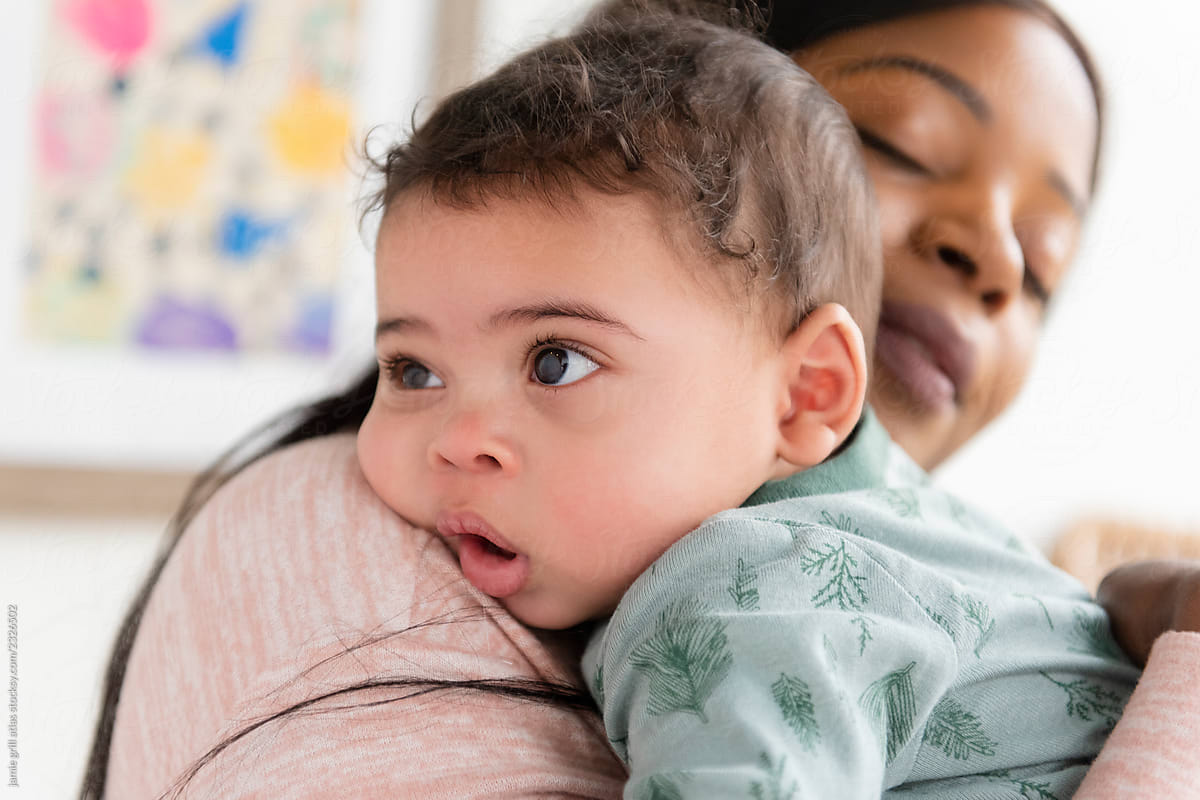 "Baby Cuddles" by Stocksy Contributor "Jamie Grill Atlas" - Stocksy