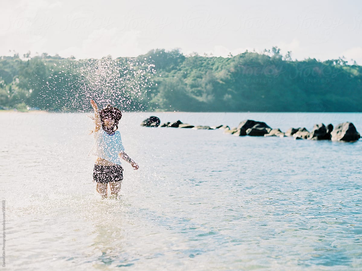 "Woman Splashing In Ocean" by Stocksy Contributor "Daniel Kim ...