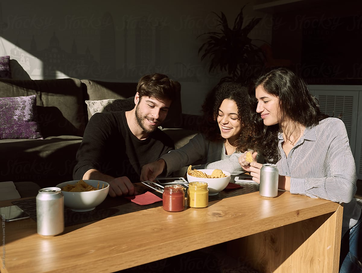 "Smiling Friends With Chips And Shots" by Stocksy Contributor "Guille ...