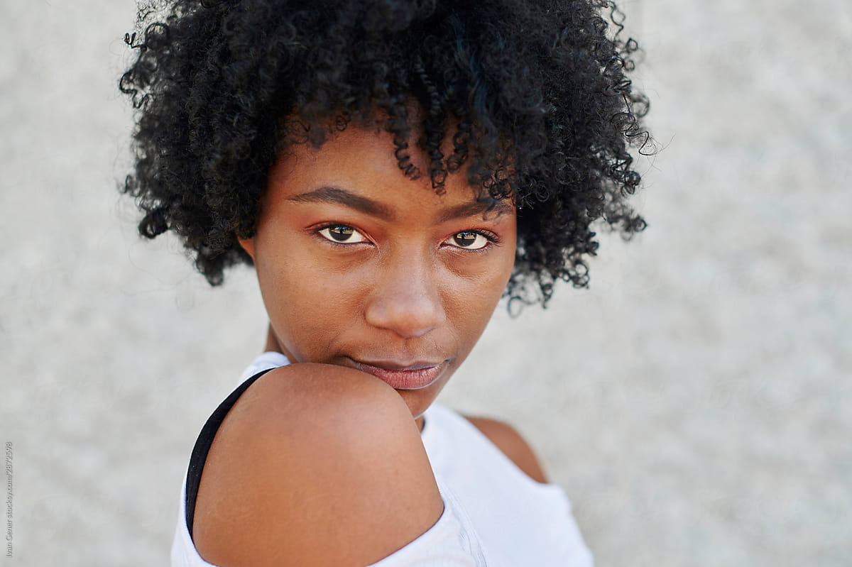 "Young Woman Glancing Over Her Shoulder" by Stocksy Contributor "Ivan ...