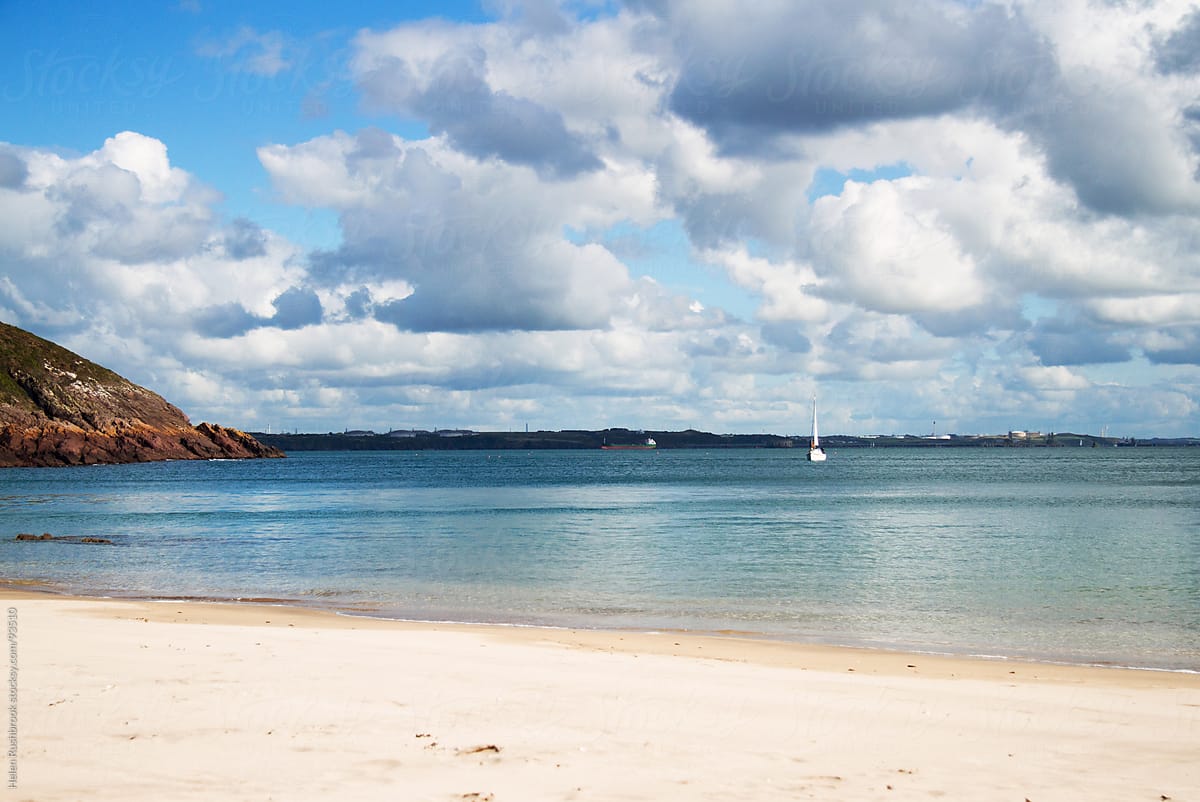 "A Yacht Sailing Towards An Idyllic Beach" by Stocksy Contributor ...