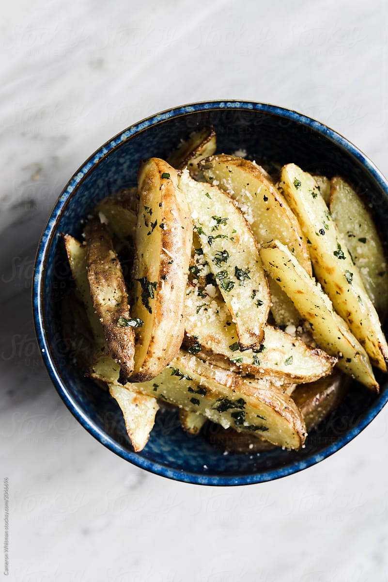 "Crispy Oven Baked Basil Fries" by Stocksy Contributor "CWP, LLC" - Stocksy