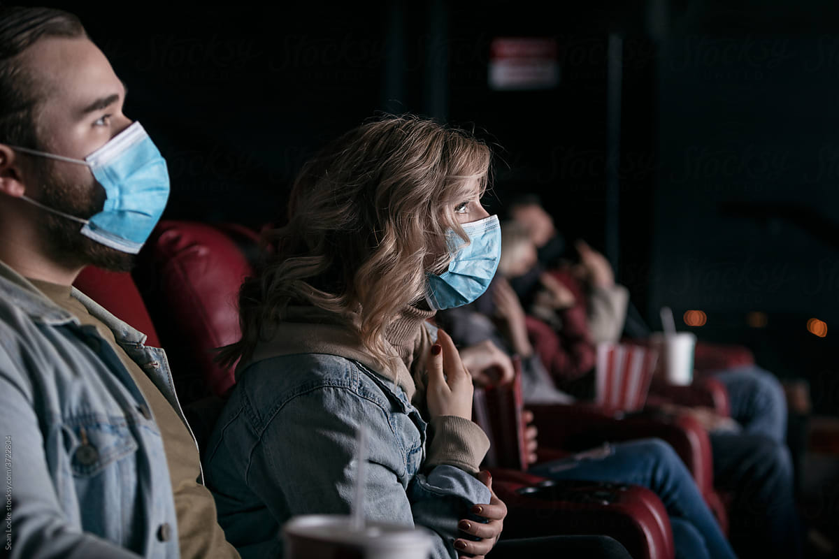 "Movies: Woman Afraid During Scary Movie" by Stocksy Contributor "Sean ...