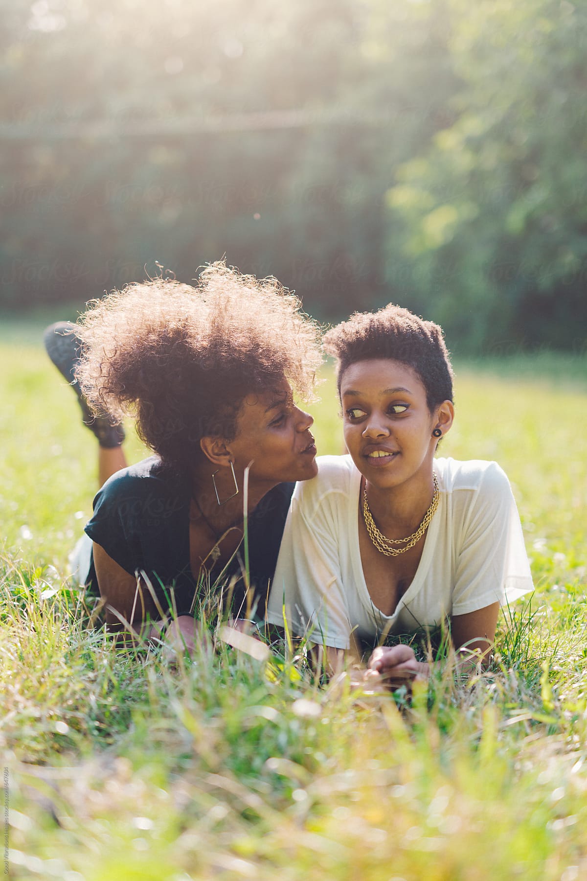 "Two Friends Relaxing Outdoors" by Stocksy Contributor "Vero." - Stocksy
