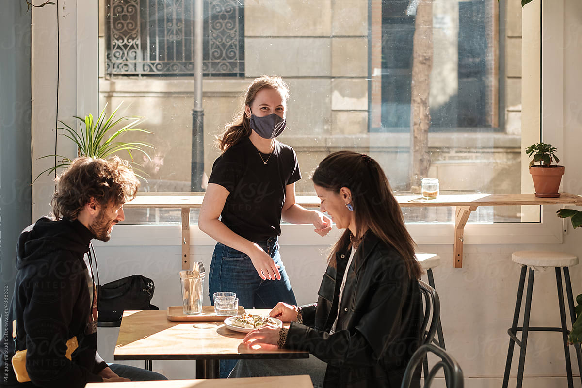 Waitress Serving food for Clients In Restaurant - Stock Image - Everypixel