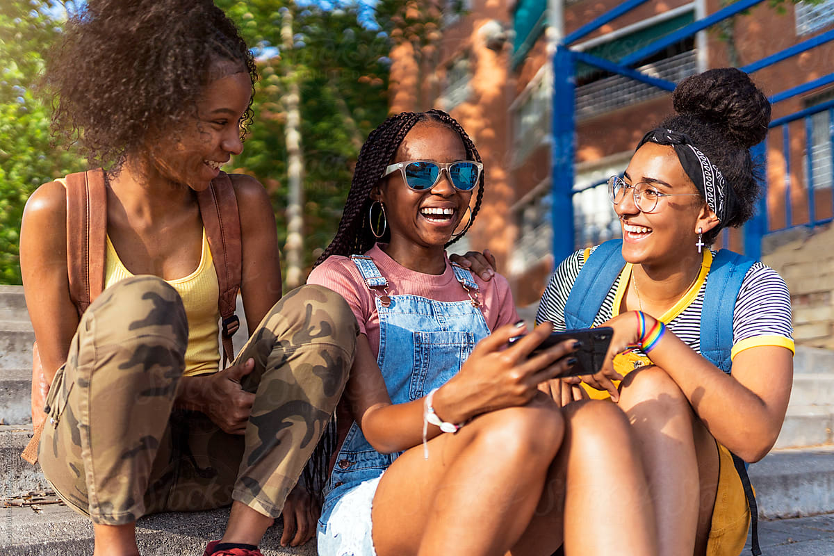 "Three African Teenage Girls Using A Smartphones" by Stocksy ...