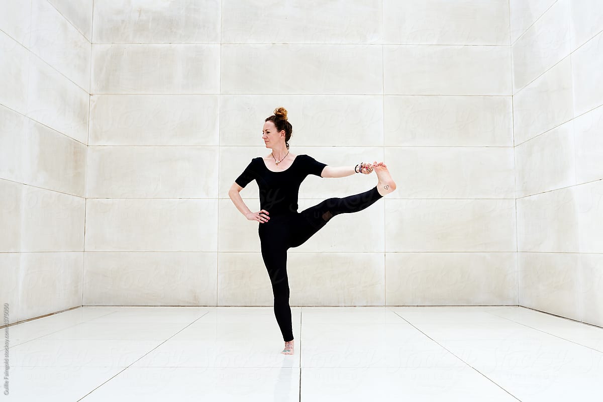 "Sporty Woman Stretching Leg" by Stocksy Contributor "Guille Faingold ...