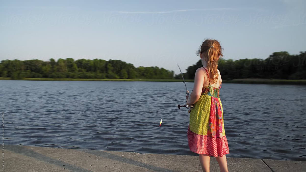 "Two Girls Fishing" by Stocksy Contributor "Gabi Bucataru" - Stocksy