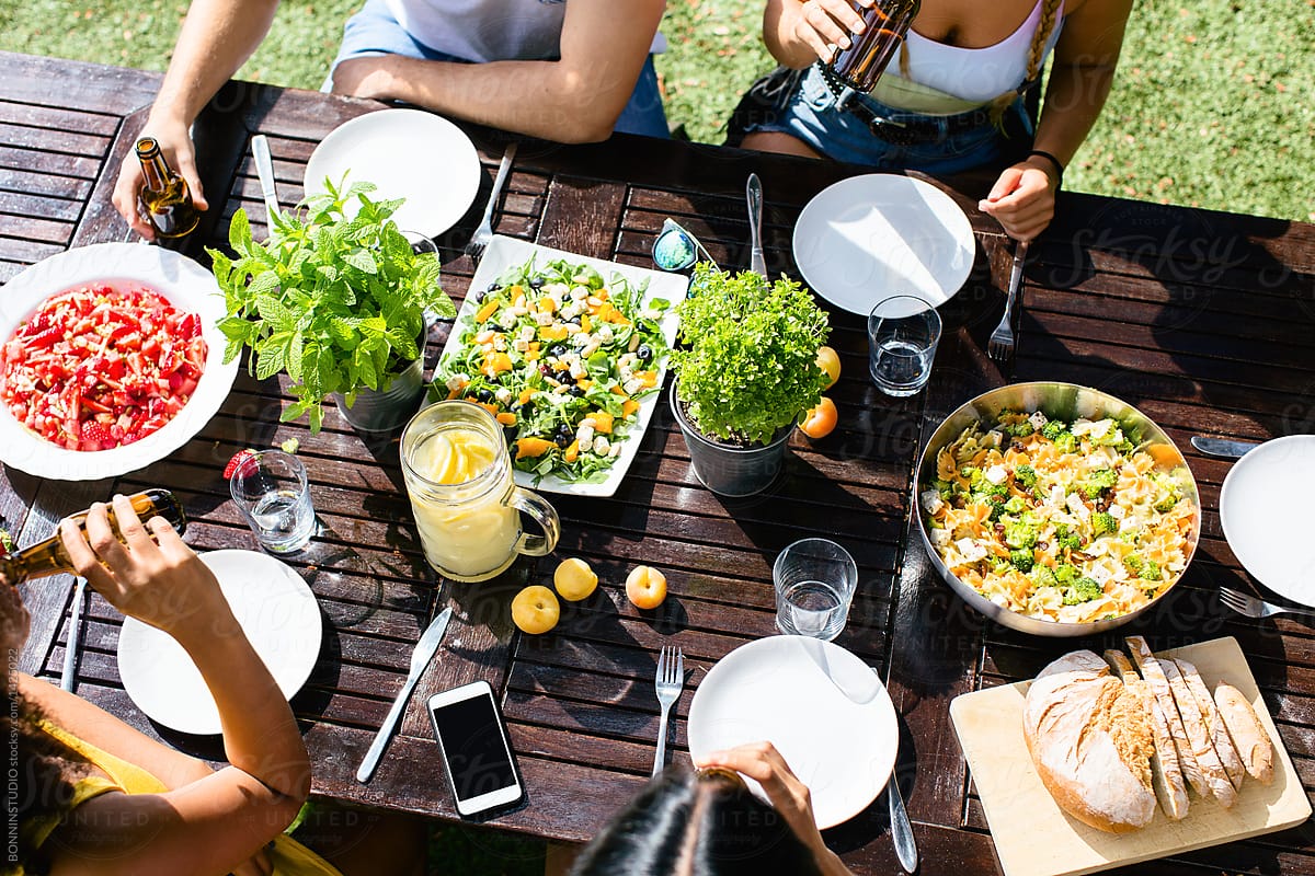 "Group Of Young Friends Gathering In A Summer Lunch." by Stocksy ...