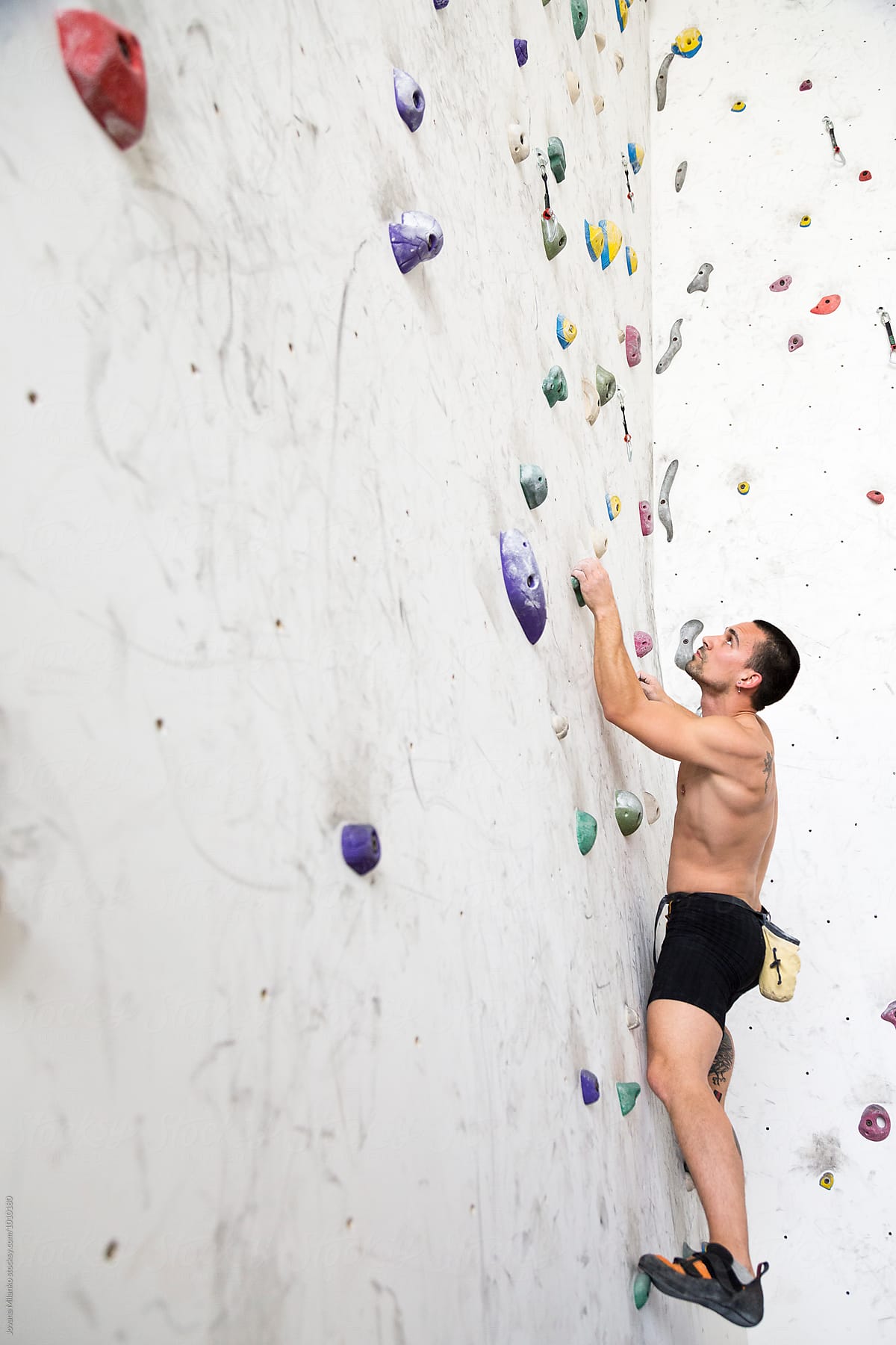 "Free Climber Exercising On An Indoor Climbing Wall" by Stocksy ...