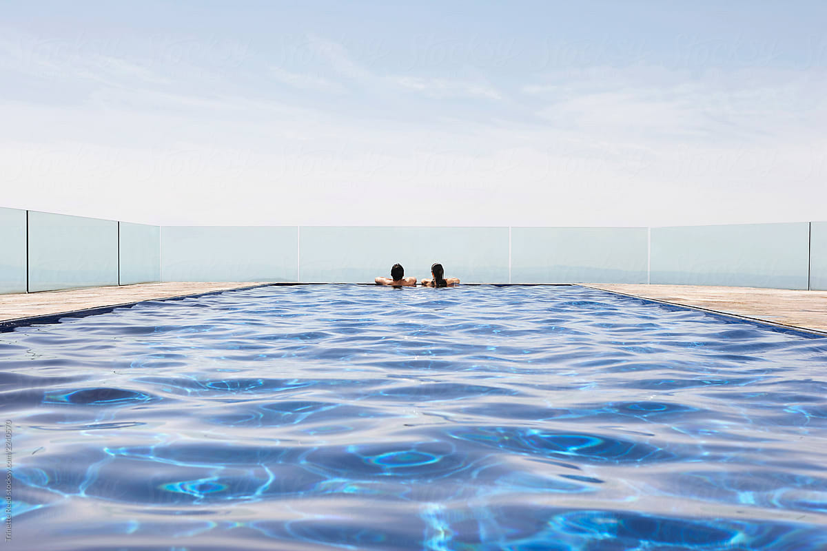 "Couple In Luxury Rooftop Pool On Vacation" by Stocksy Contributor ...