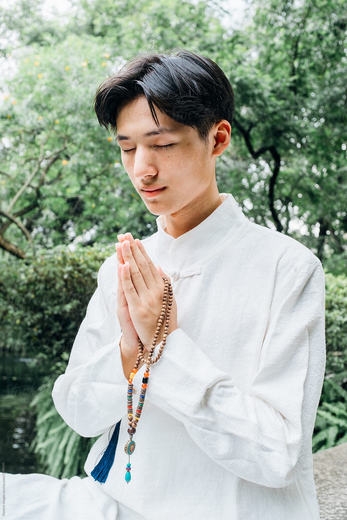 "Asian Man With Zen Buddha Gesture" by Stocksy Contributor "Pansfun ...