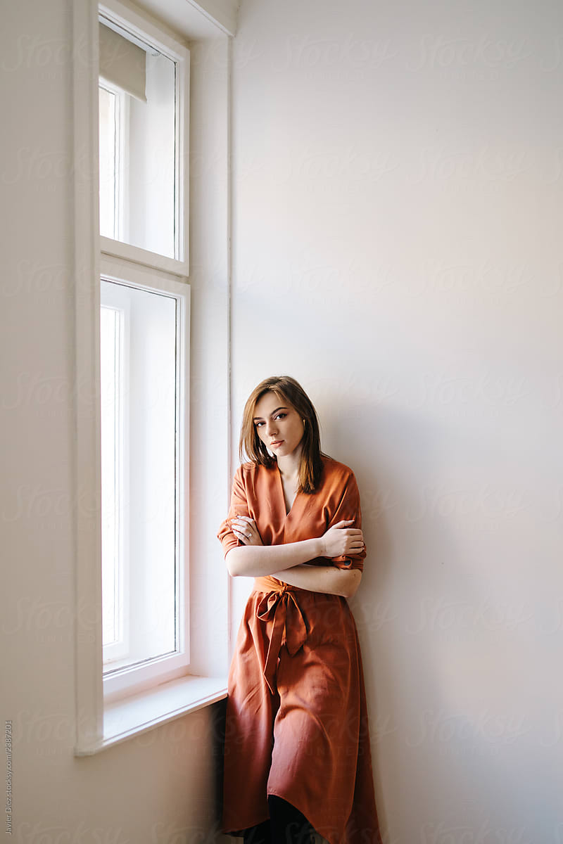 "Beautiful Woman Standing Near Window" by Stocksy Contributor "Javier ...