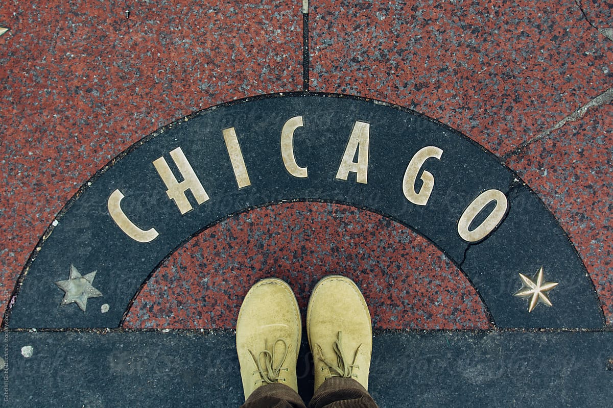 "Pair Of Dessert Boots On A Chicago Sign In The Sidewalk" by Stocksy ...