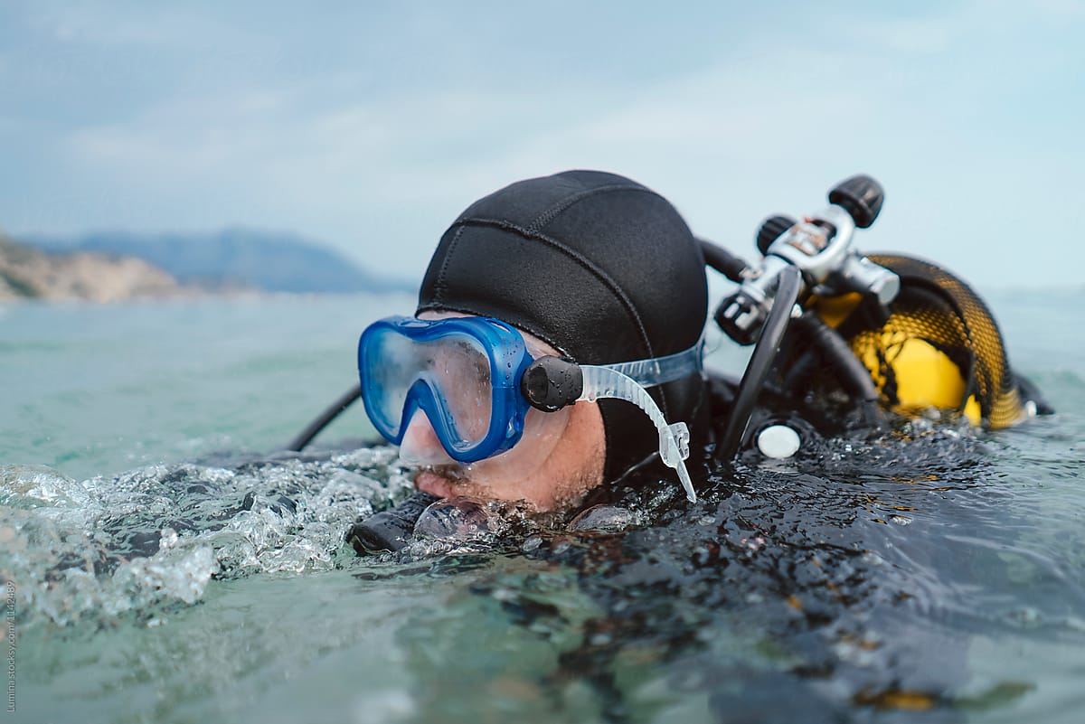 "Scuba Diver Preparing To Go Unerwater" by Stocksy Contributor "Lumina ...