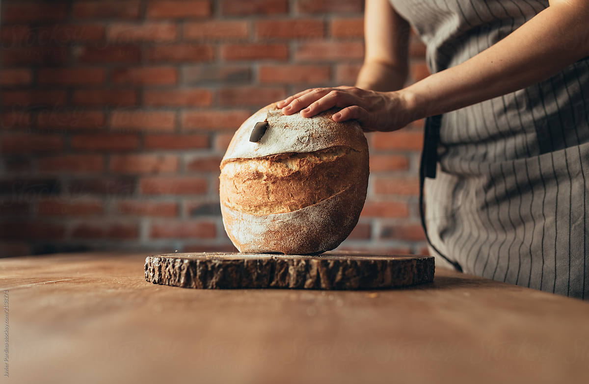 "Woman Holding Homemade Bread" by Stocksy Contributor "Pardina Studio x ...
