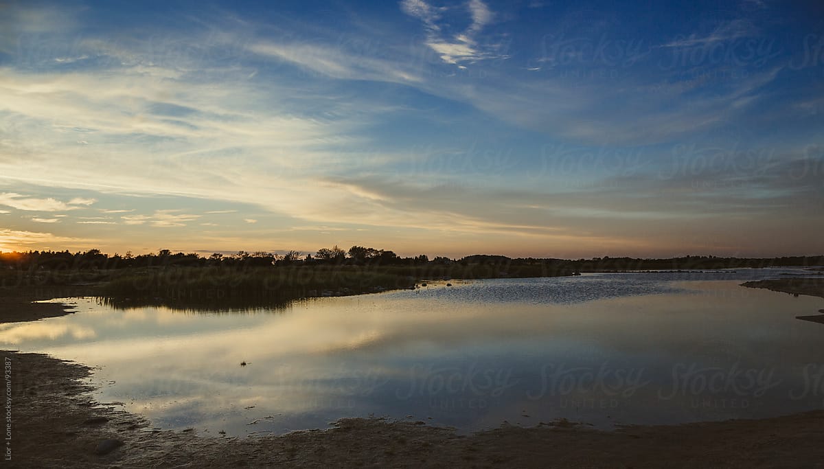 "Sky Reflecting On Water At Sunset" by Stocksy Contributor "Lior + Lone ...