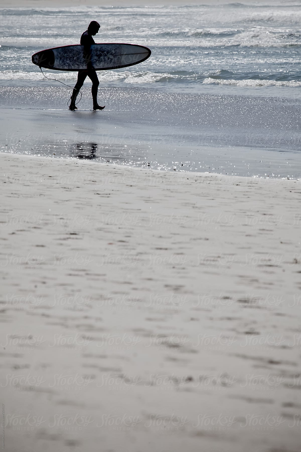 "Early Morning Surfer" by Stocksy Contributor "Rowena Naylor" - Stocksy